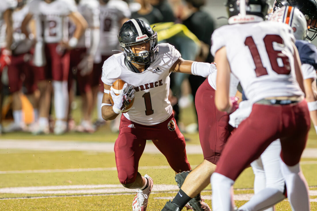 Lawrence running back takes on multiple roles in offense in pursuit of ...